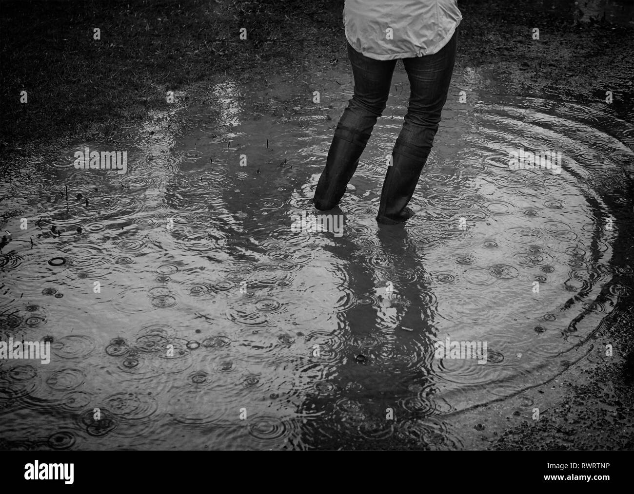 Adult in puddle Black and White Stock Photos & Images - Alamy