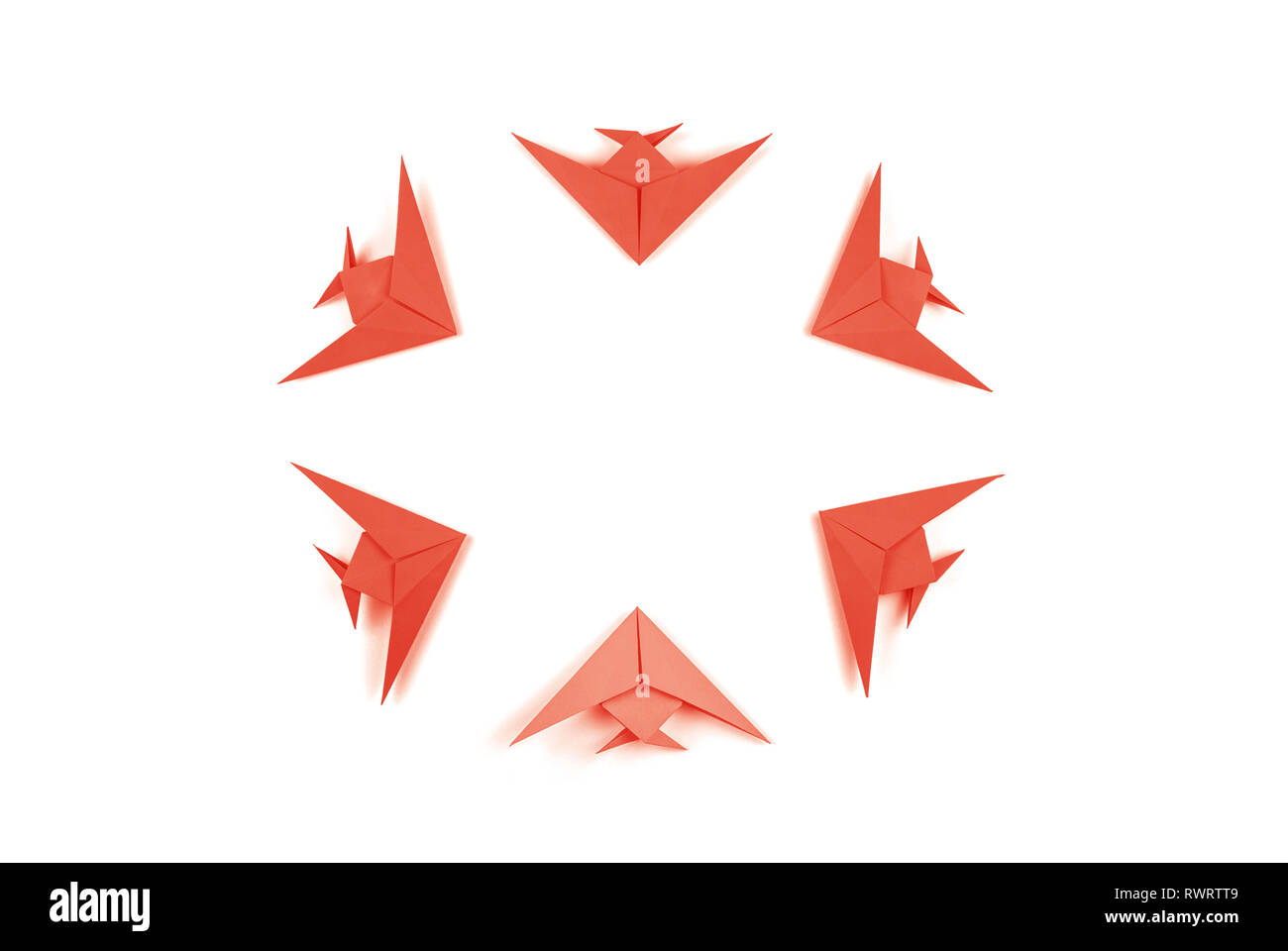 Coral origami fishes isolated on white background Stock Photo - Alamy
