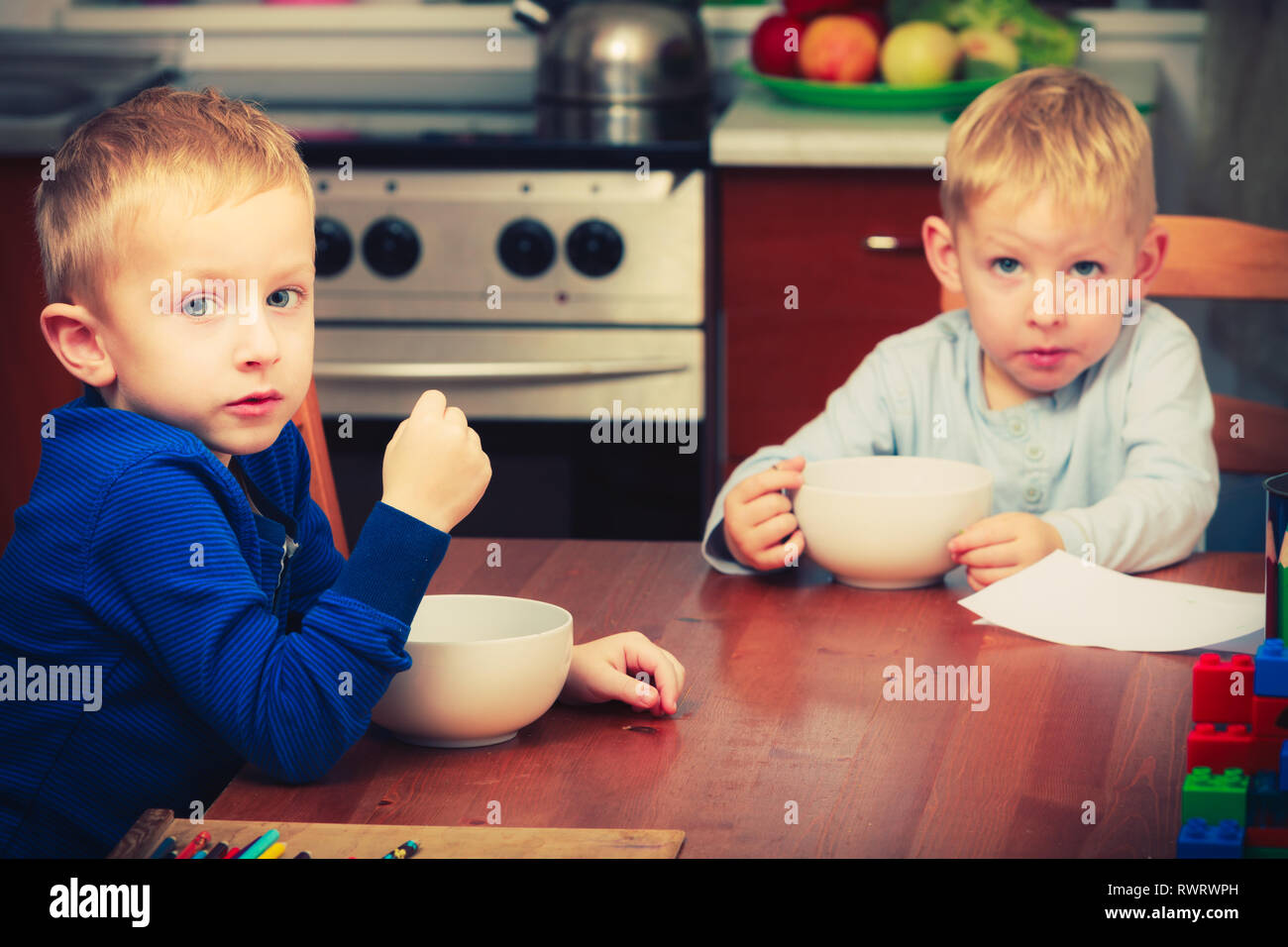 Morning routine in family, healthy diet for children concept. Two boys ...