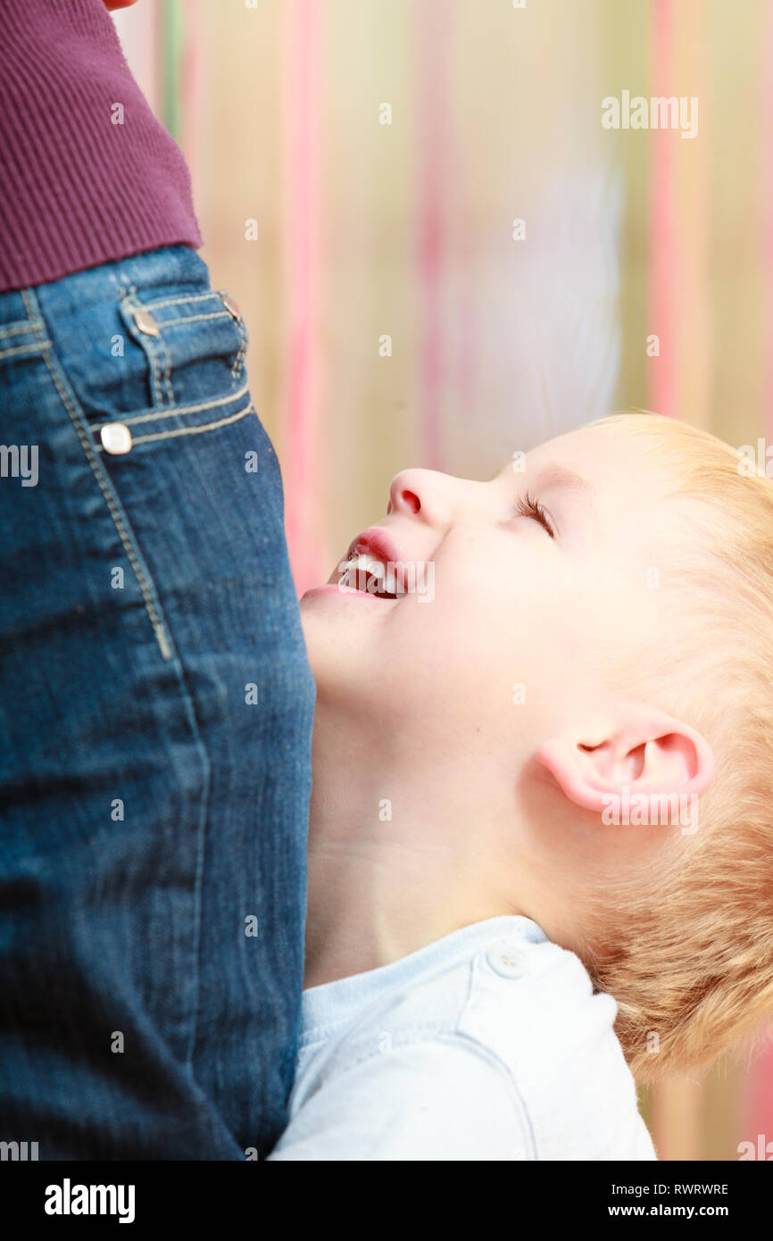 Happy childhood. Portrait of smiling blond boy child kid son hugging ...