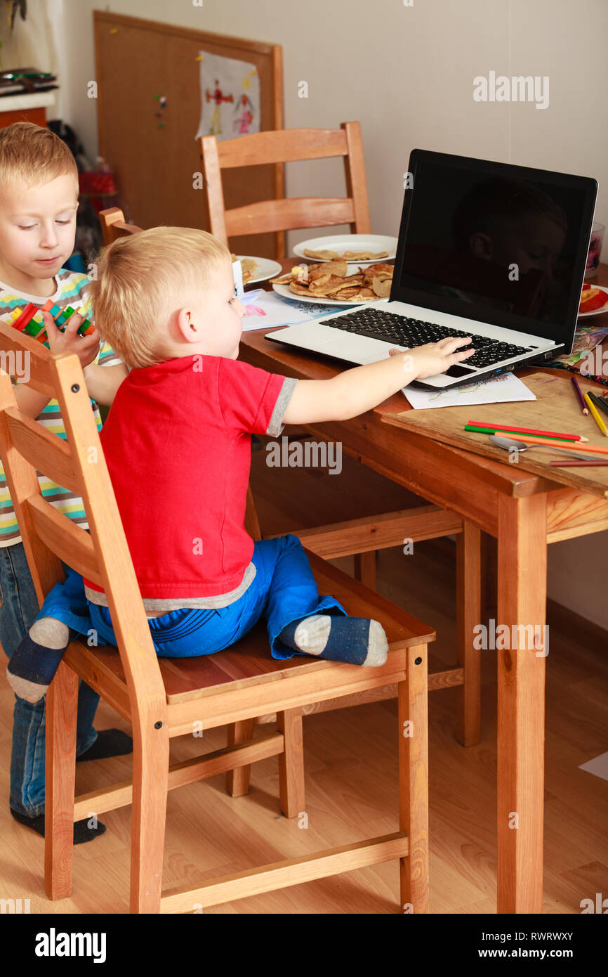 Children and technology, spending free time online concept. Little boy ...