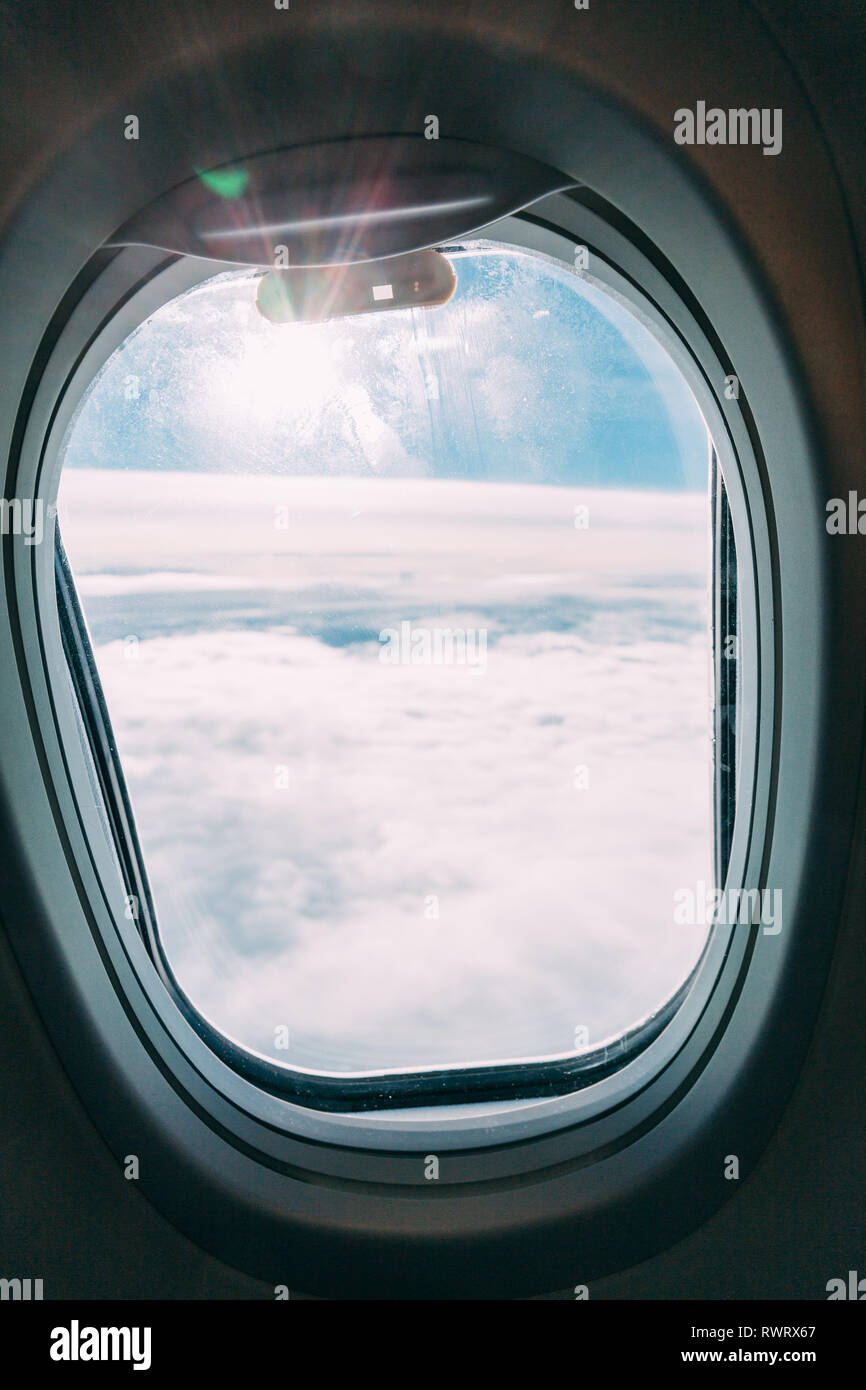 plane window with blue sunny sky view Stock Photo - Alamy