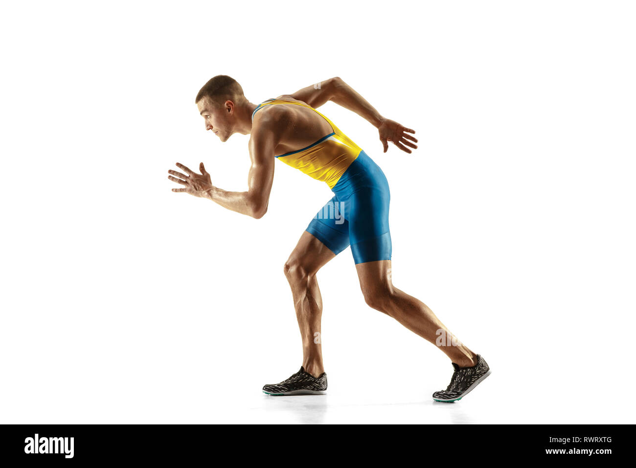 Young caucasian man running isolated on white studio background. One ...