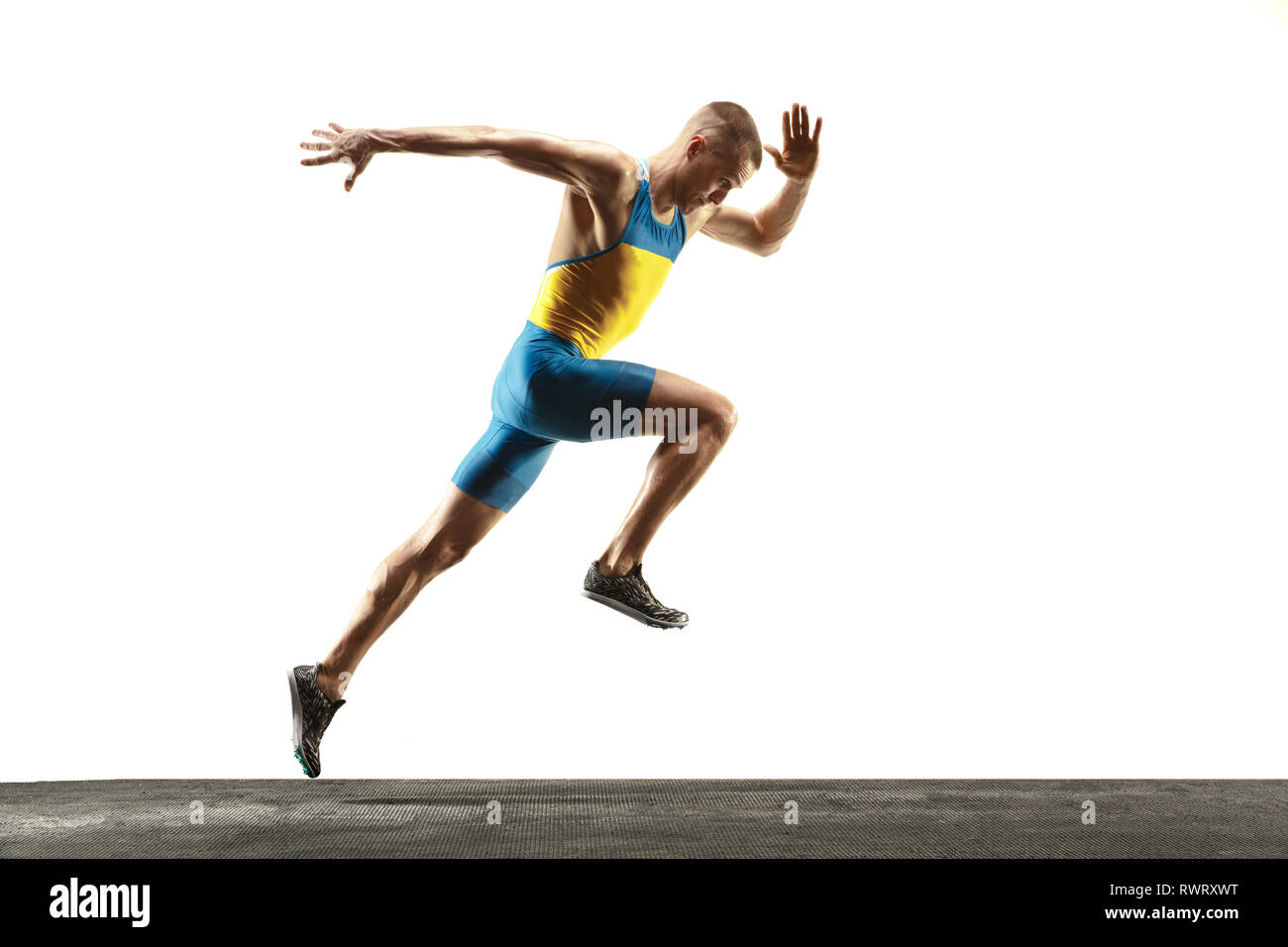 Young caucasian man running isolated on white studio background. One ...