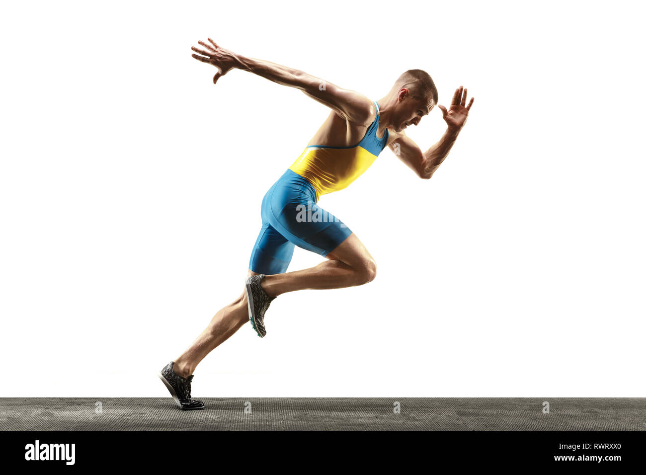 Young caucasian man running isolated on white studio background. One ...