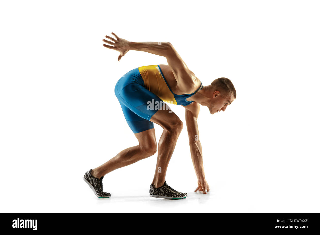 Young caucasian man running isolated on white studio background. One ...