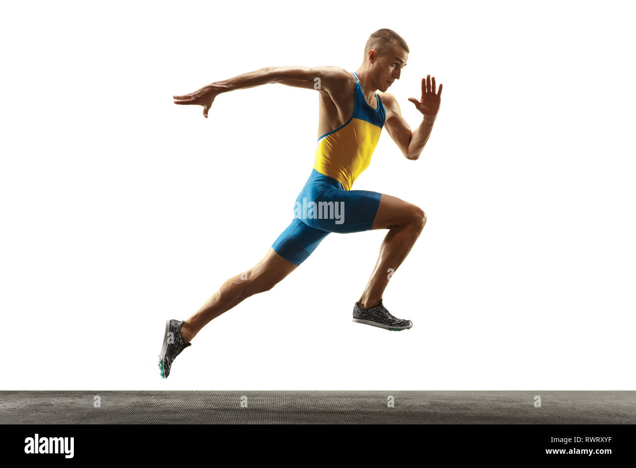 Young caucasian man running isolated on white studio background. One ...
