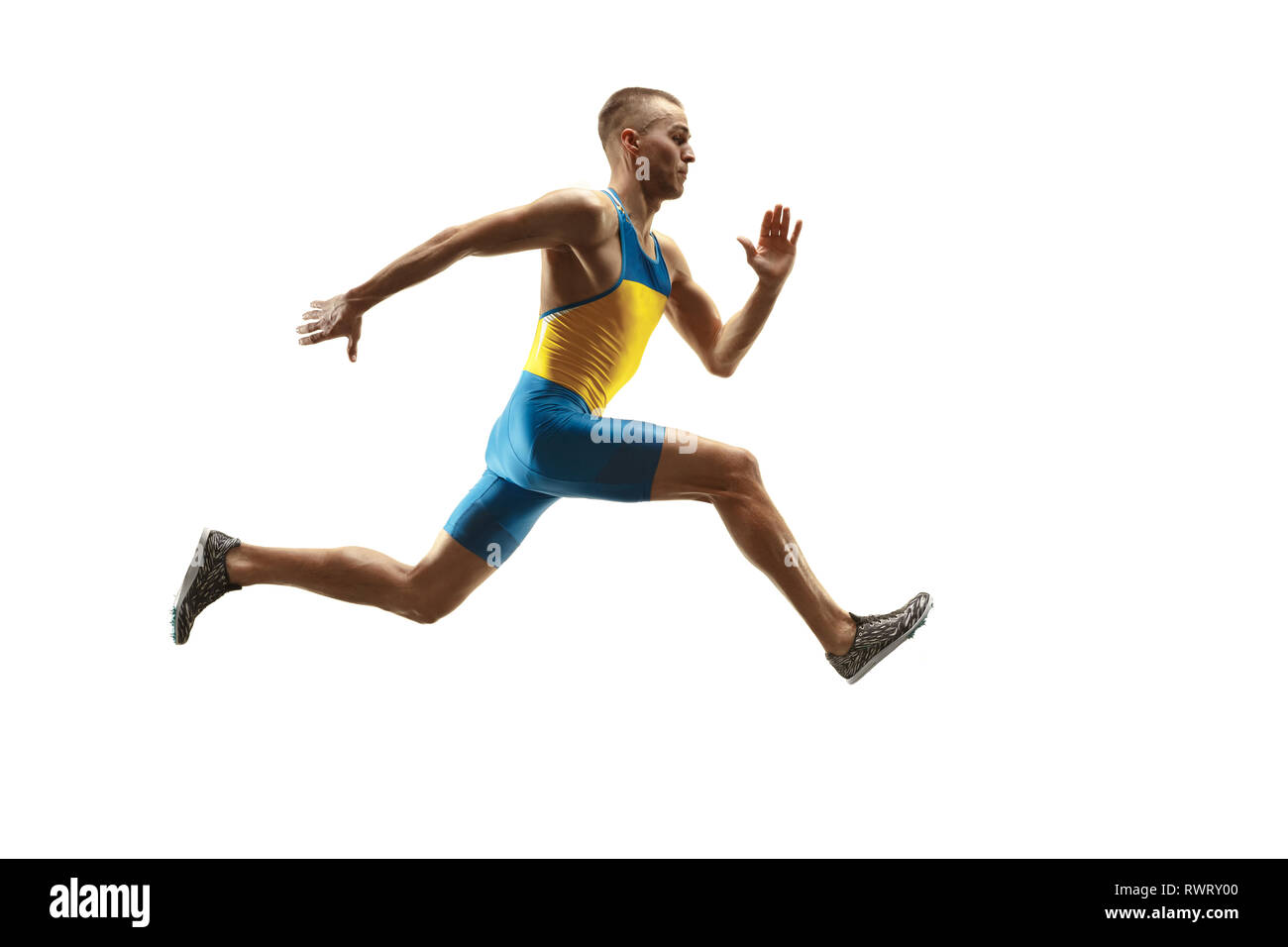 Young caucasian man running isolated on white studio background. One ...