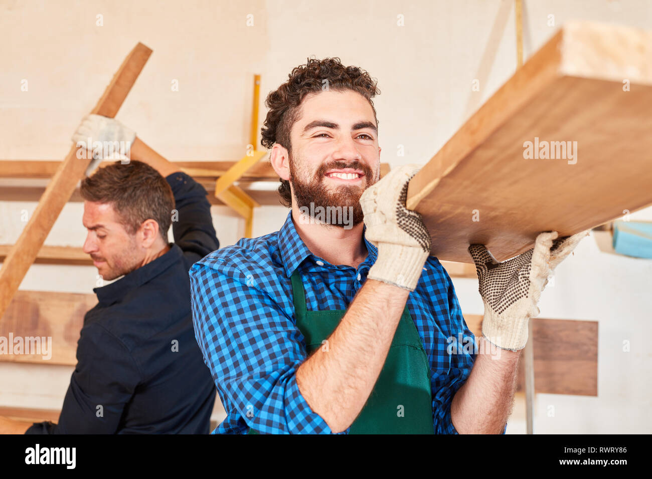 Male apprentice working carpenter in hi-res stock photography and ...
