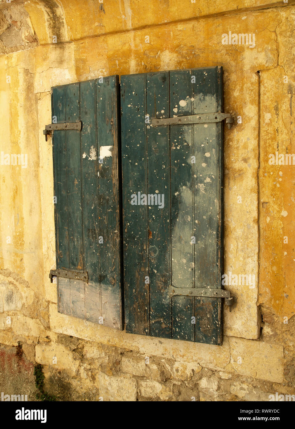 Old wooden window shutters in back streets and alley ways of old Corfu ...