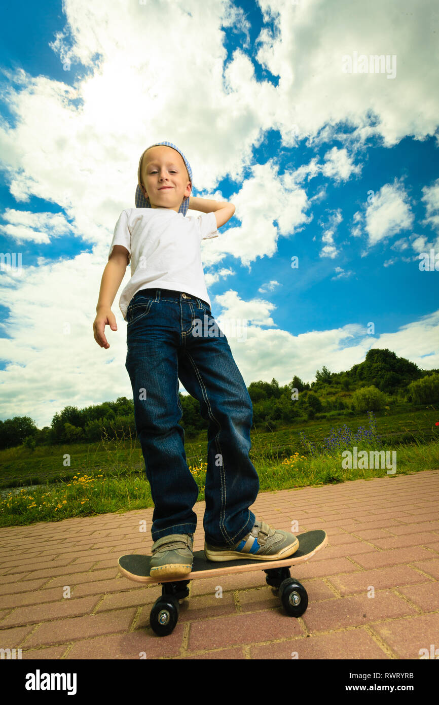 Active childhood. Little man skateboarding. Skater boy child kid with ...