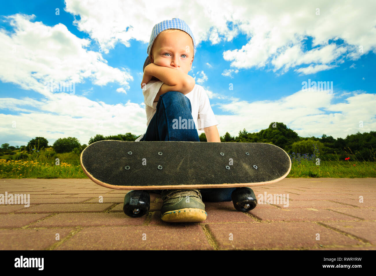 Active childhood. Little man skateboarding. Skater boy child kid with ...