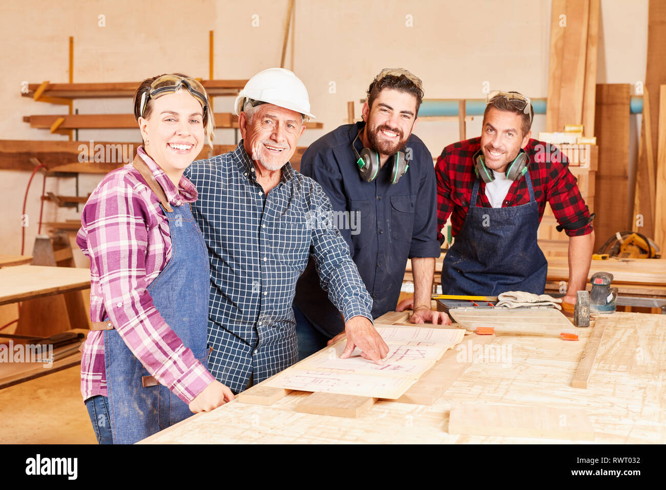 Craftsman team planning house construction in the workshop Stock Photo ...