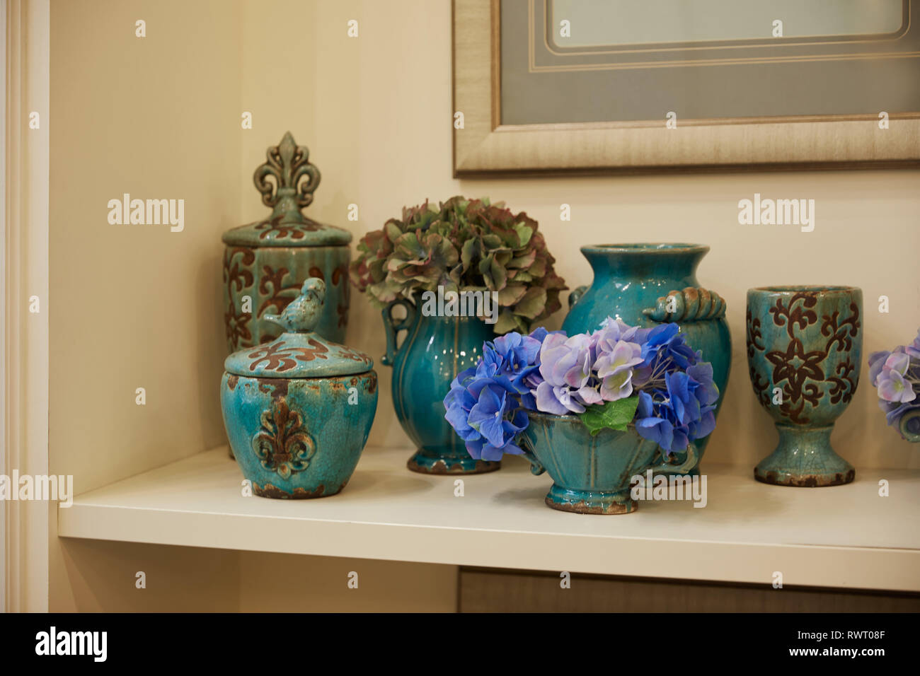 turquoise set with blue flowers on surface Stock Photo - Alamy