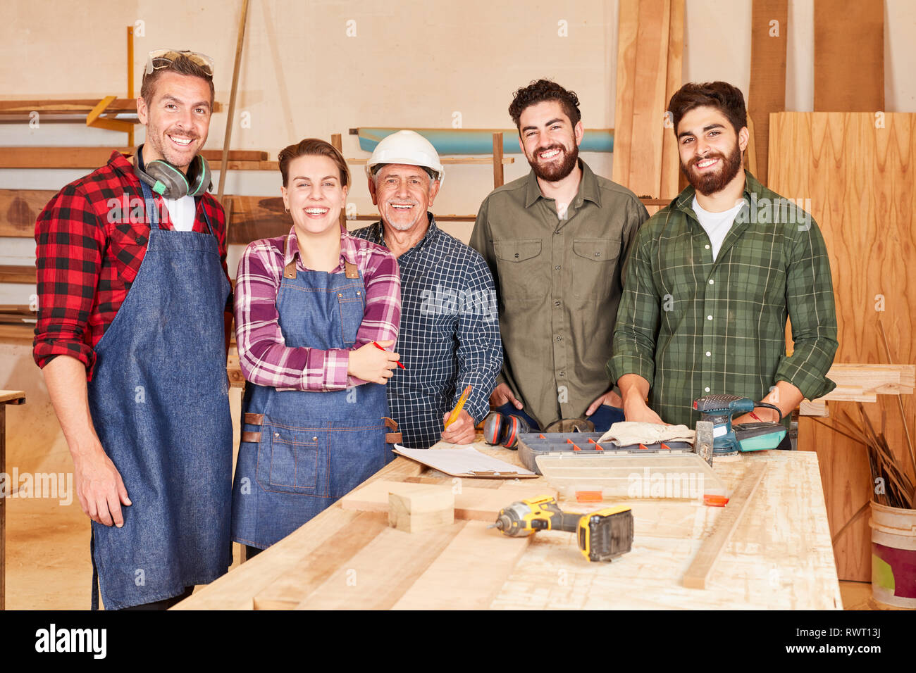 Carpenter team with senior boss and artisan apprentices together in the ...