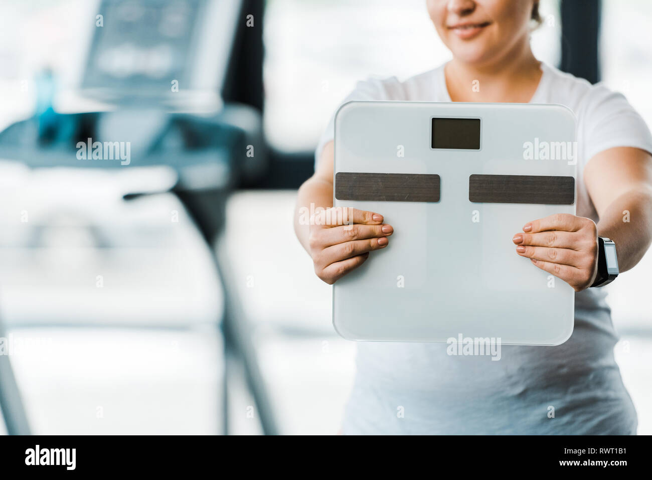 Overweight girl scales hi-res stock photography and images - Alamy