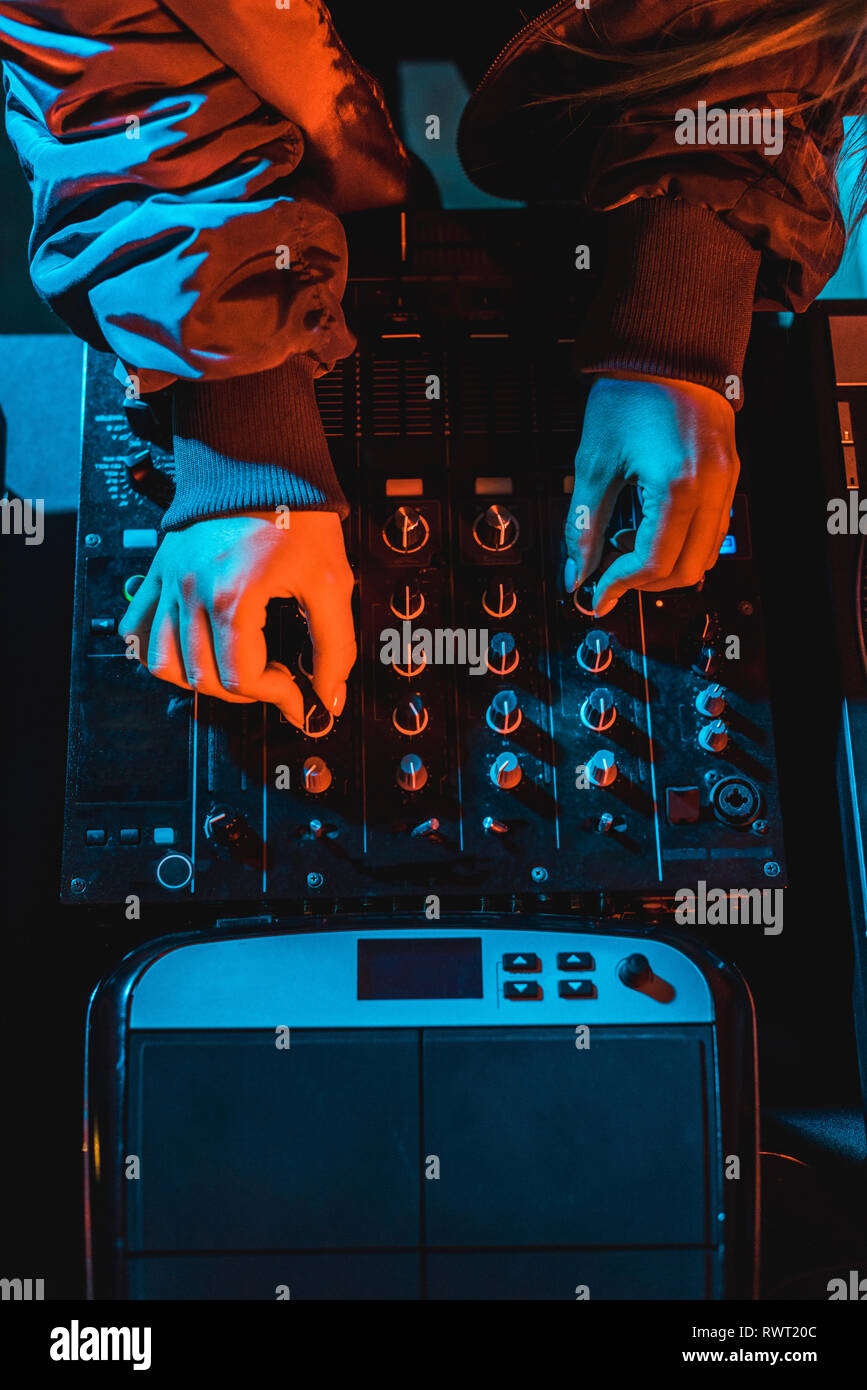 top view of dj woman touching dj mixer in nightclub Stock Photo - Alamy