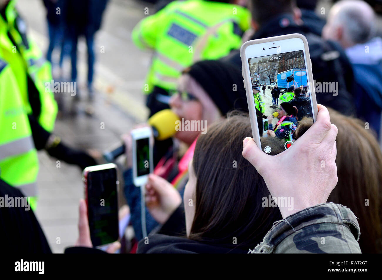 Phone filming protest uk hi-res stock photography and images - Alamy