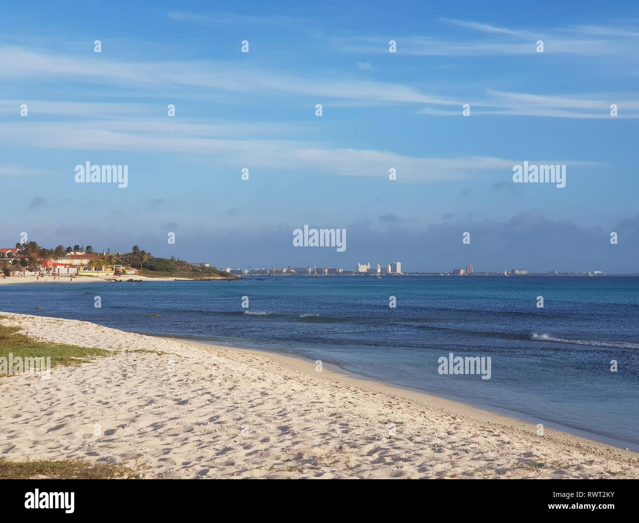 Aruban beach with a nice, but far skyline in the back Stock Photo - Alamy