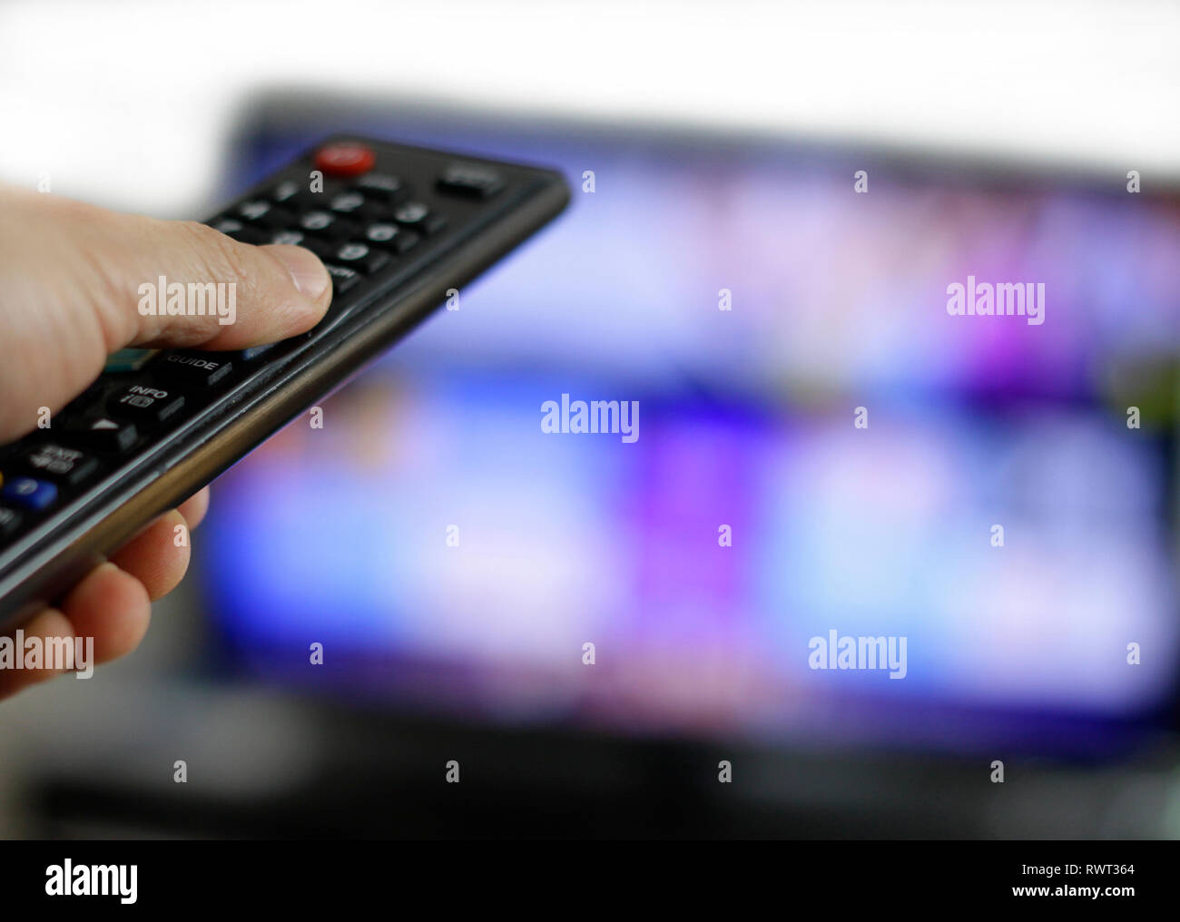 Remote control and screen - binge watching the favourite TV show Stock ...