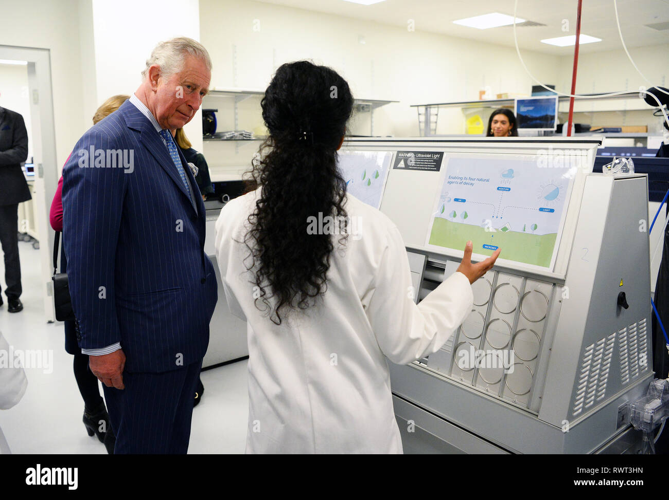 The Prince of Wales speaks to scientists in a laboratory during his ...