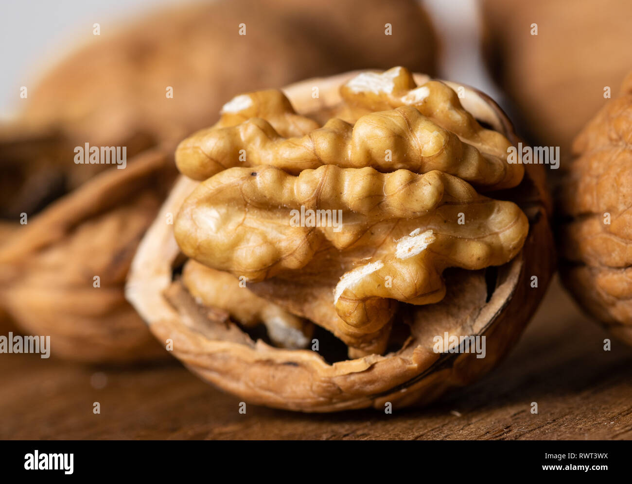Open and cracked walnut closeup macro Stock Photo - Alamy