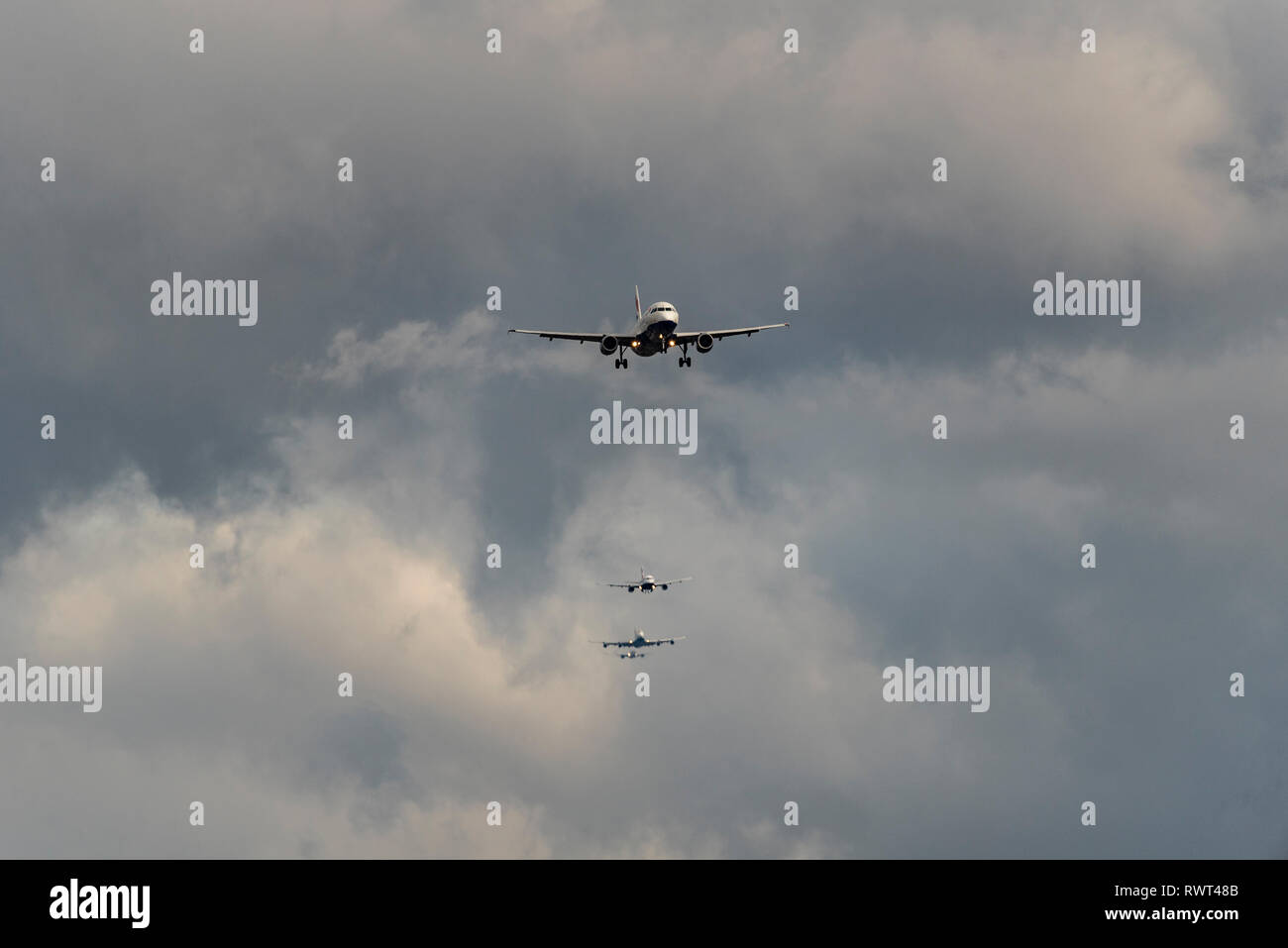 Queue of planes on final approach to land at London Heathrow Airport ...