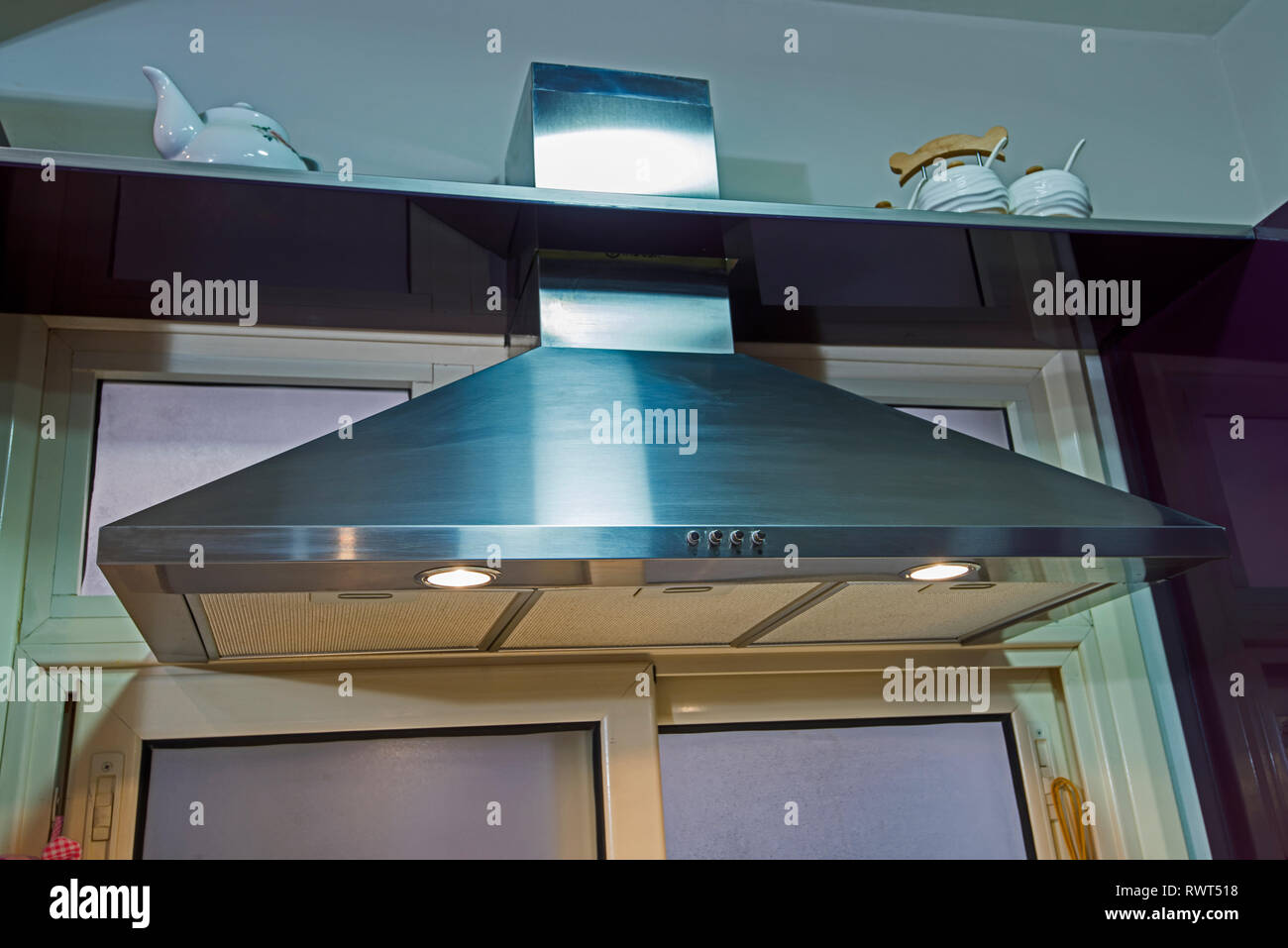 Interior design decor of modern kitchen showing extractor fan appliance ...