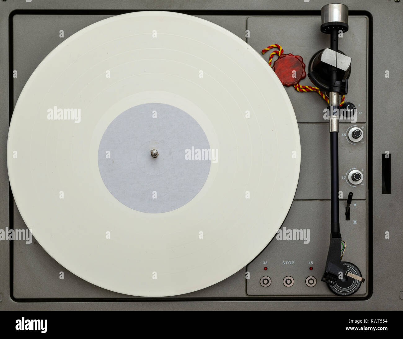 Vintage vinyl turntable with vinyl plate. Listen to music. Top view ...