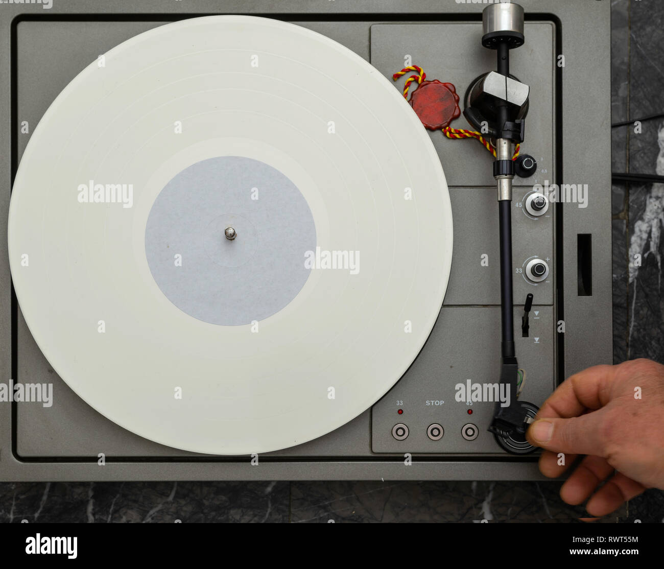 Vintage vinyl turntable with vinyl plate. Listen to music. Top view ...