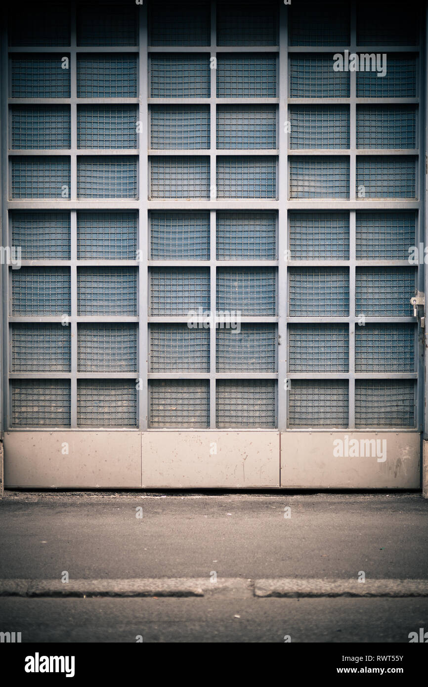 Metallic door with square pattern Stock Photo - Alamy