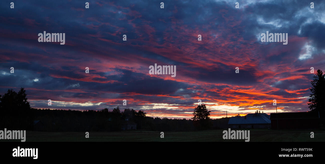 Vivid clouds at dawn before sunrise Stock Photo - Alamy