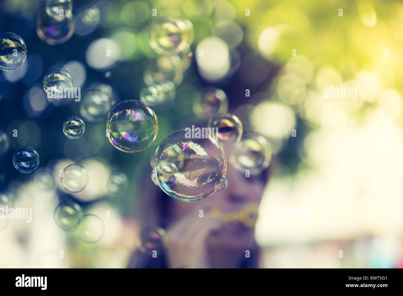 Colorful soap bubbles outdoors, summer time, fun Stock Photo - Alamy