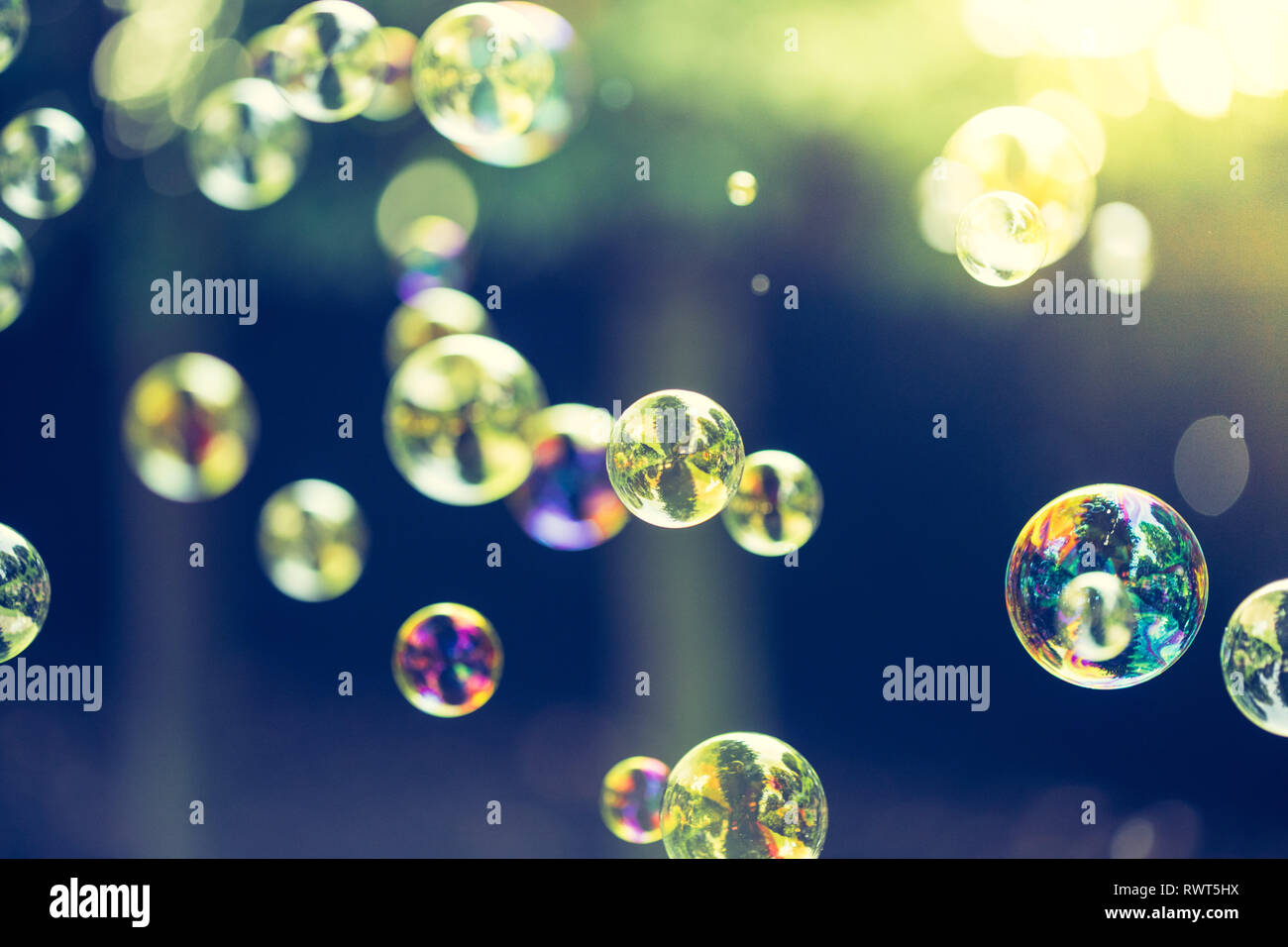 Colorful soap bubbles outdoors, summer time, fun Stock Photo - Alamy