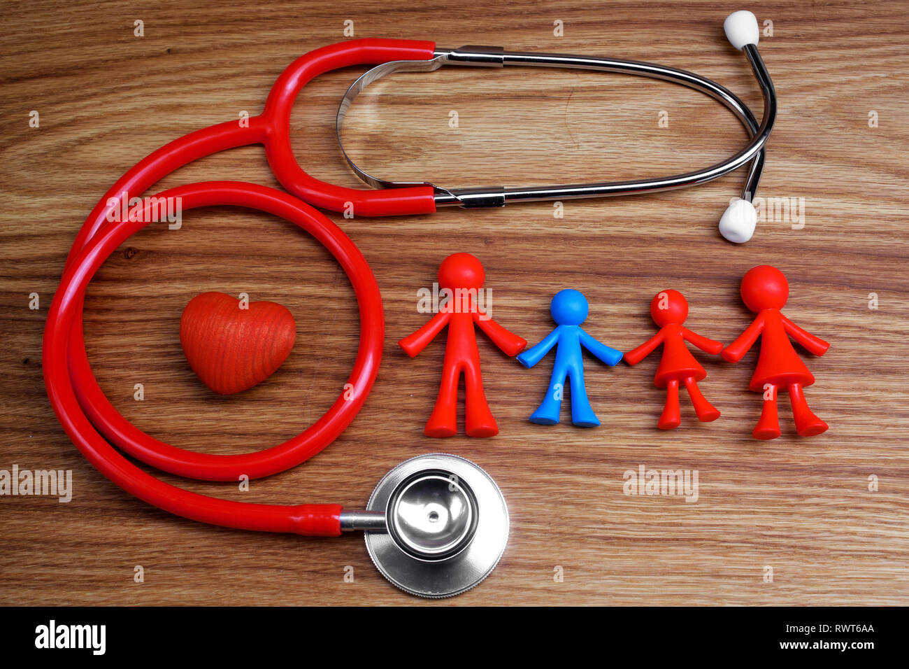 Doll family background with one different child and stethoscope. Autism ...