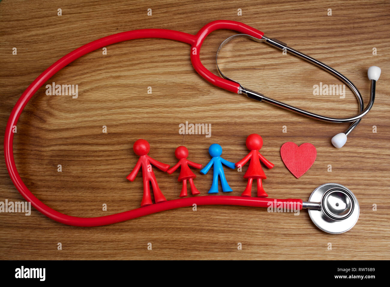 Doll family background with one different child and stethoscope. Autism ...