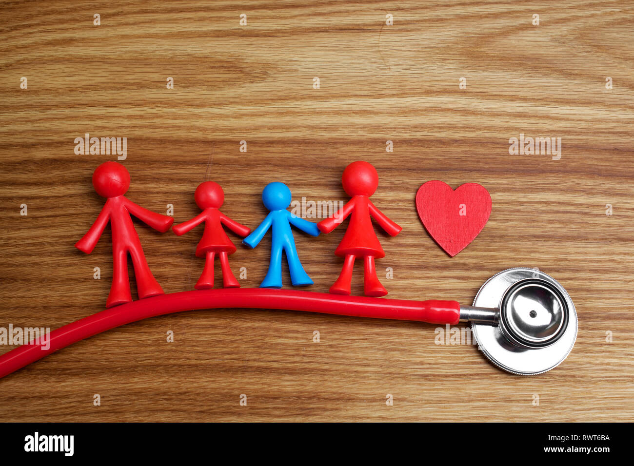 Doll family background with one different child and stethoscope. Autism ...