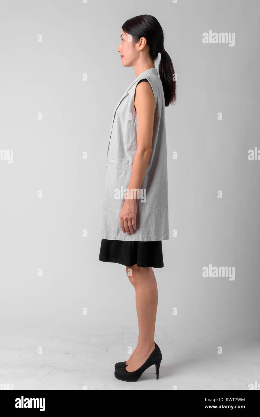 Full body shot profile view of beautiful Japanese businesswoman Stock ...