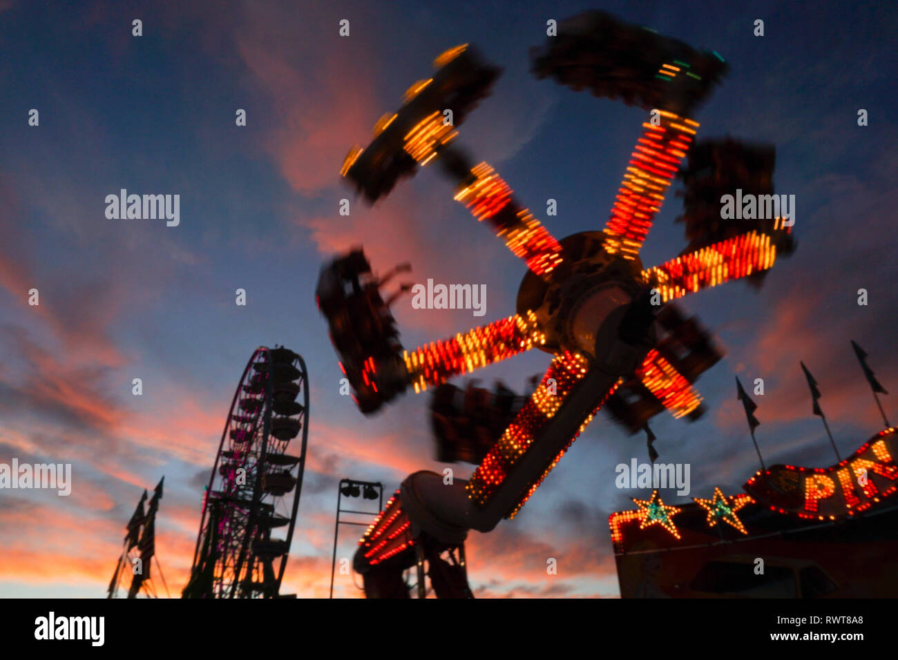 Amusement park rides at a local fairgrounds Stock Photo - Alamy