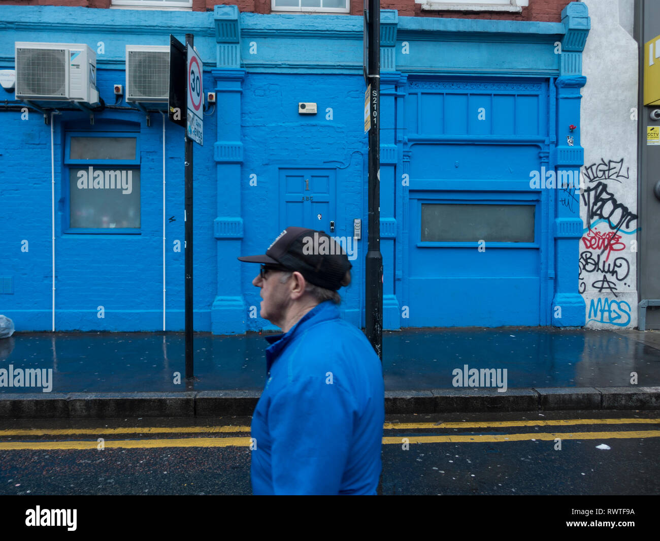 Blue Man and Blue House Stock Photo - Alamy