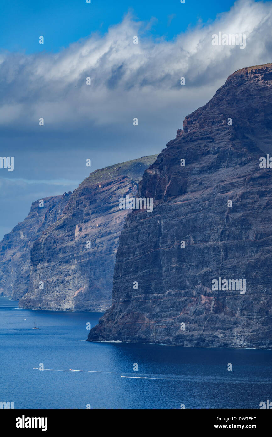 Los Gigantes cliffs vertical scene with cloudy sky Stock Photo - Alamy