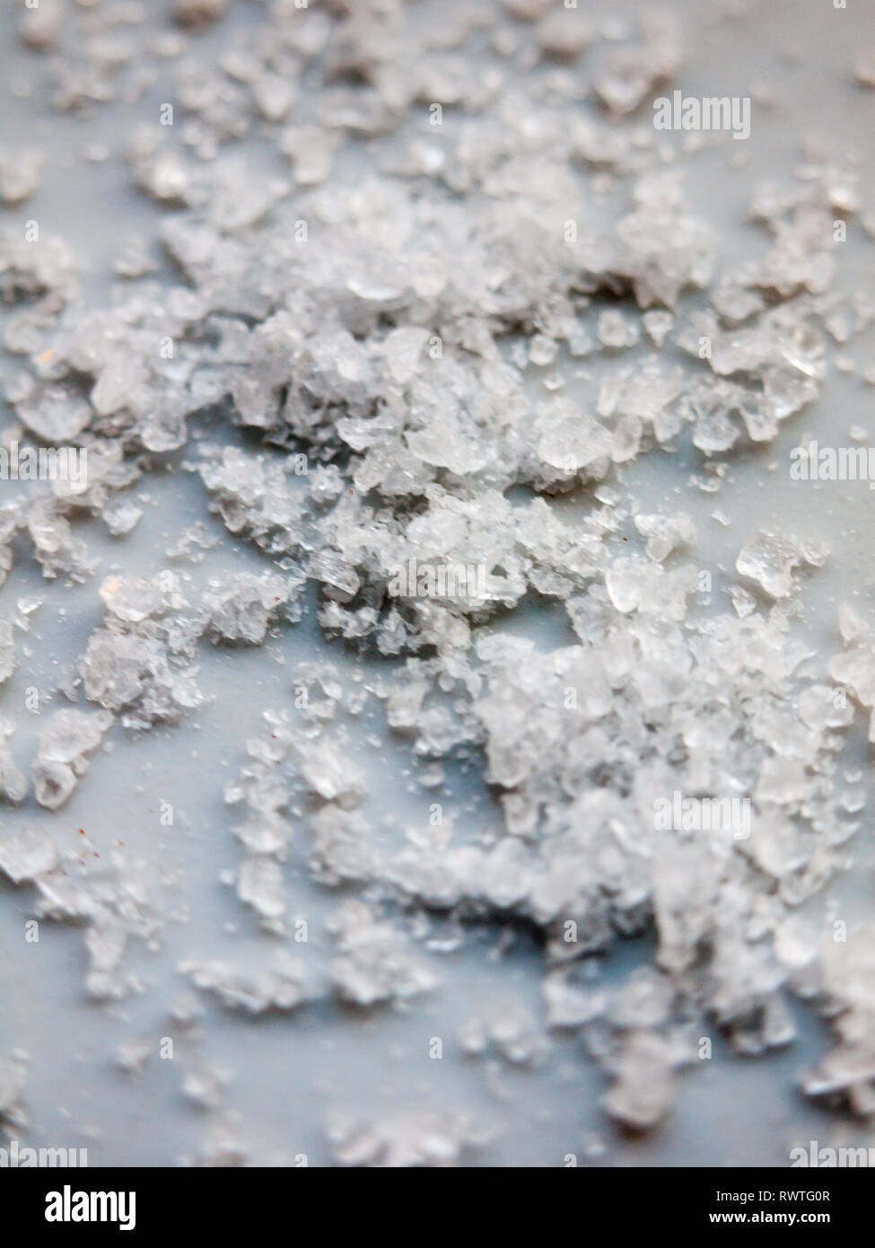 close up of salt grains on white background sea salt; essex; england ...