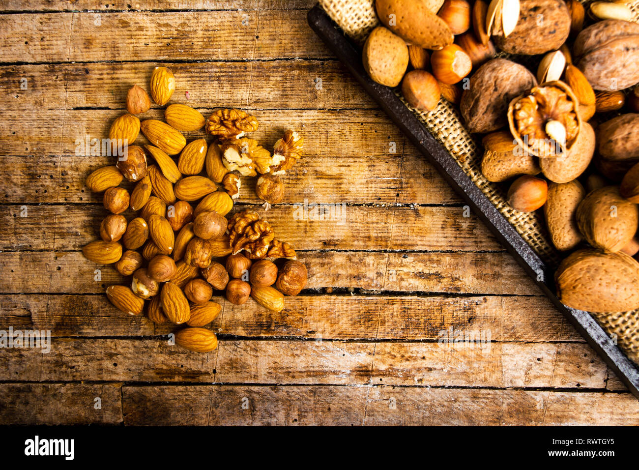Various nuts on a pile top view, healthy food Stock Photo - Alamy