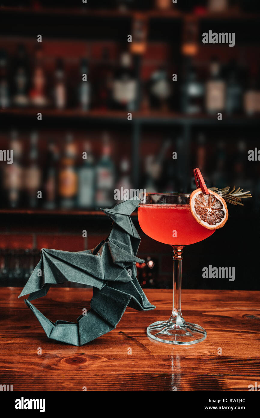 Exotic cocktail with origami Stock Photo - Alamy