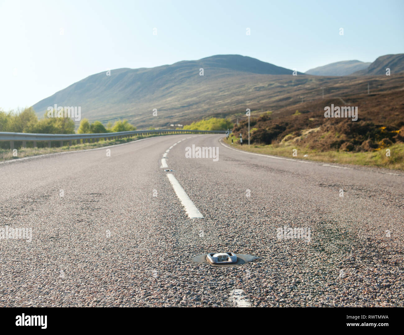 country road winding through the Scottish Highlands. UK. Focus on the ...