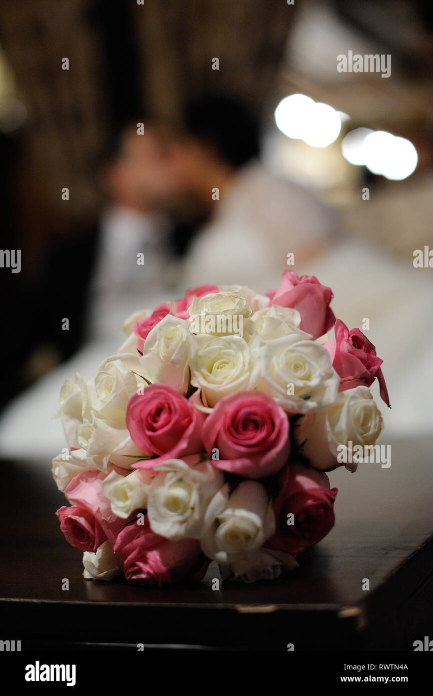bridal bouquet of white roses and roses and in the background couple of ...
