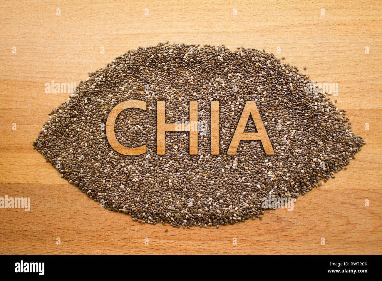 chia seeds with wooden background Stock Photo - Alamy