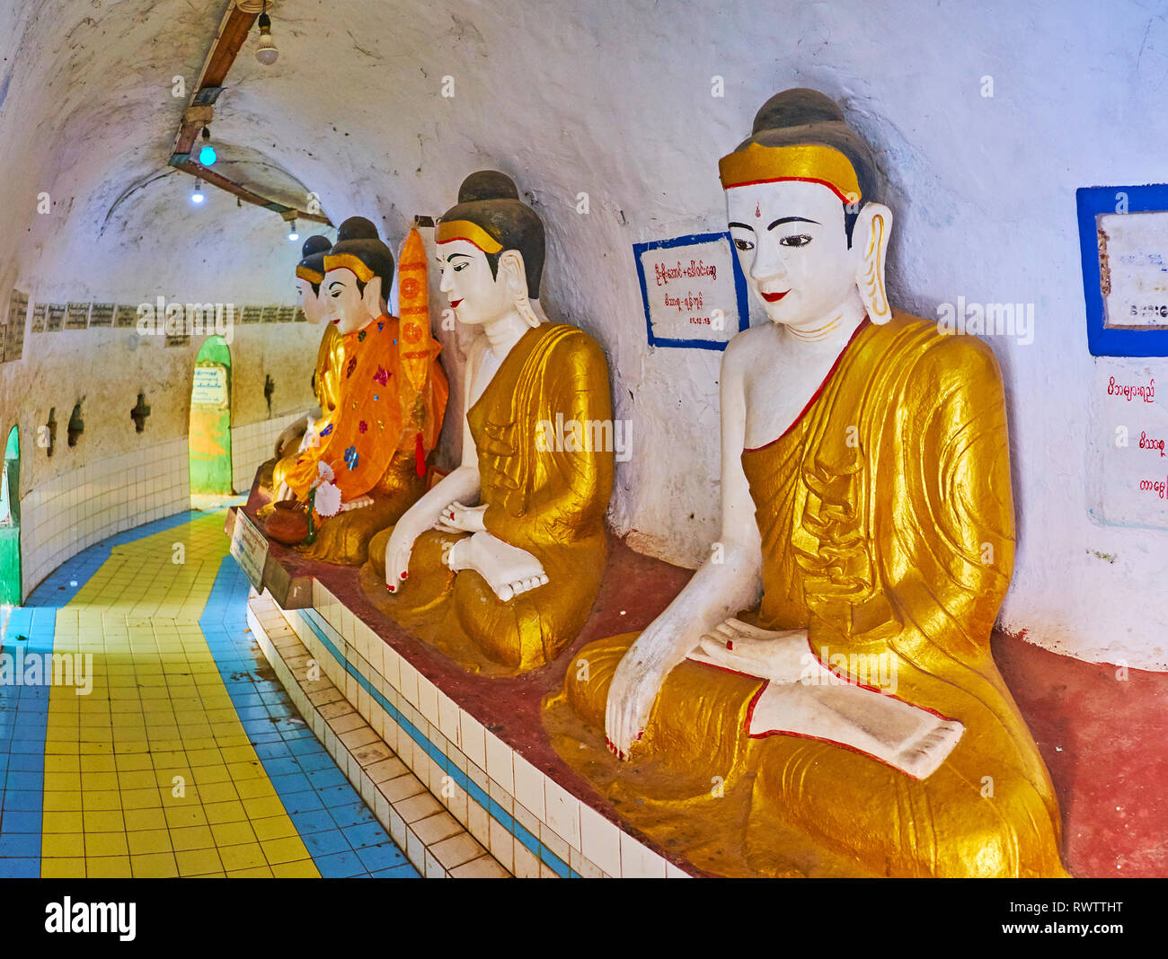 BAGO, MYANMAR - FEBRUARY 15, 2018: The scenic gilt statues of Buddha ...