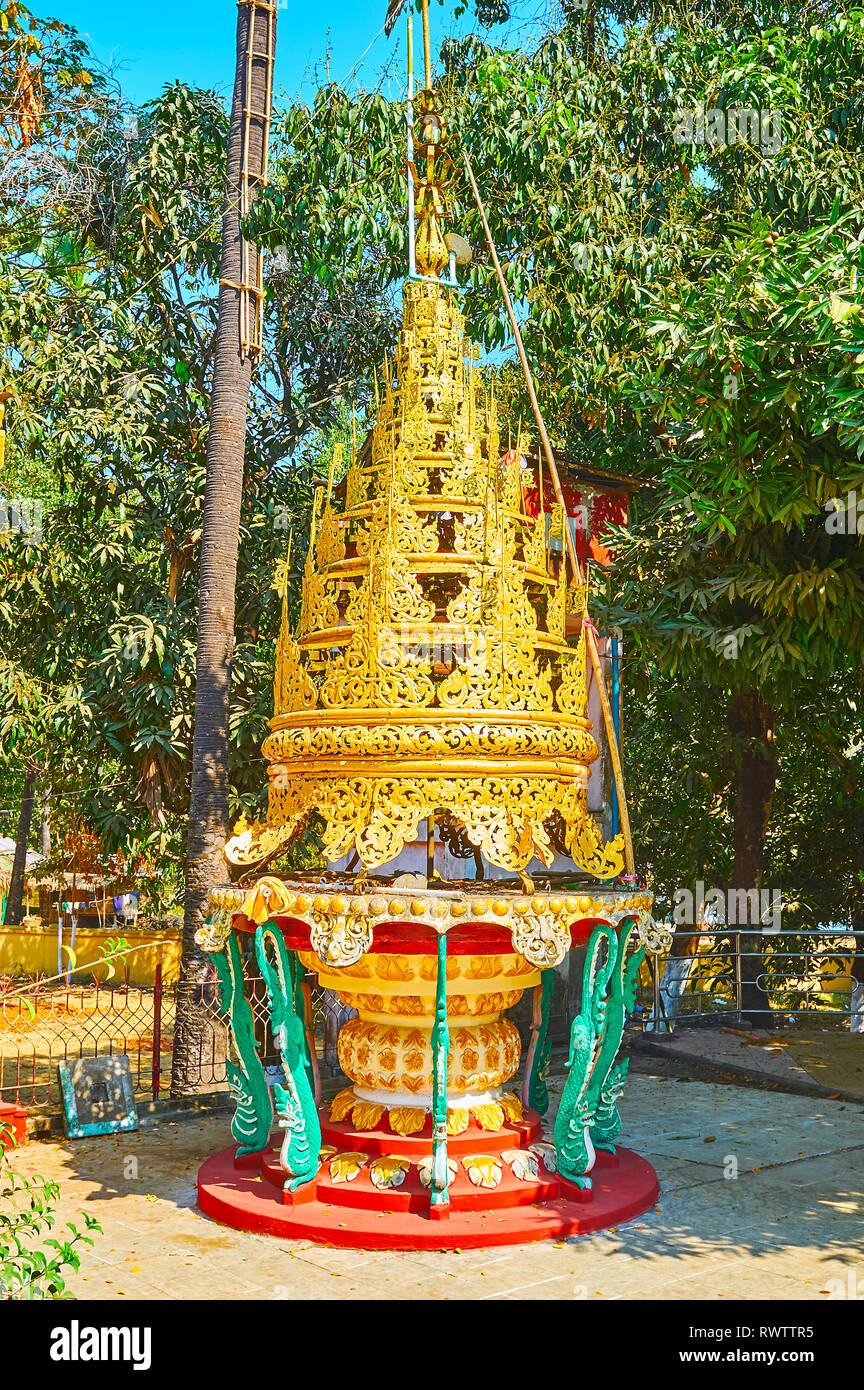 The ornate hti umbrella - traditional top of the stupa, located in ...