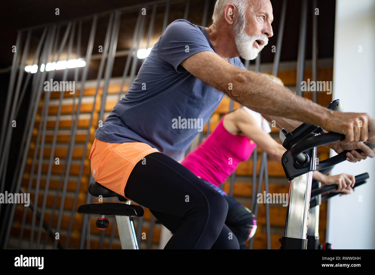 Senior man at the gym doing exercise to stay healthy Stock Photo - Alamy